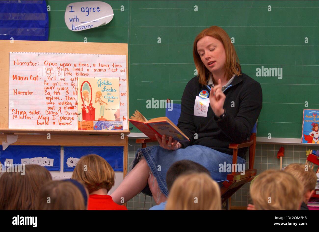 May 03, 3004: Student teacher works with first graders reading at ...