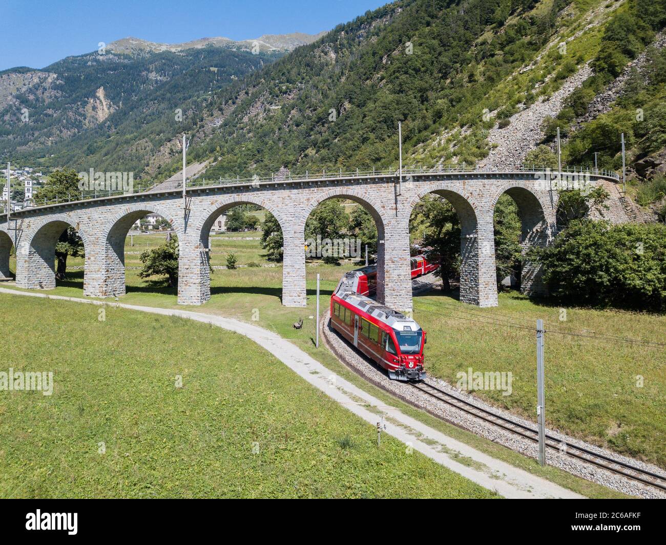 Brusio, Switzerland: 26 August 2018 - Bernina Express is going through ...