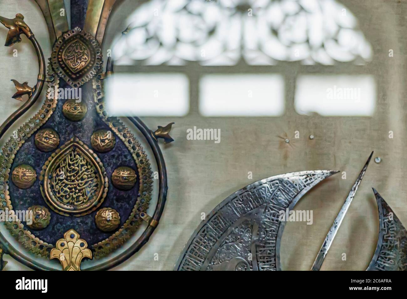 A metal shield/armor on display inside a glass cabinet at the ...