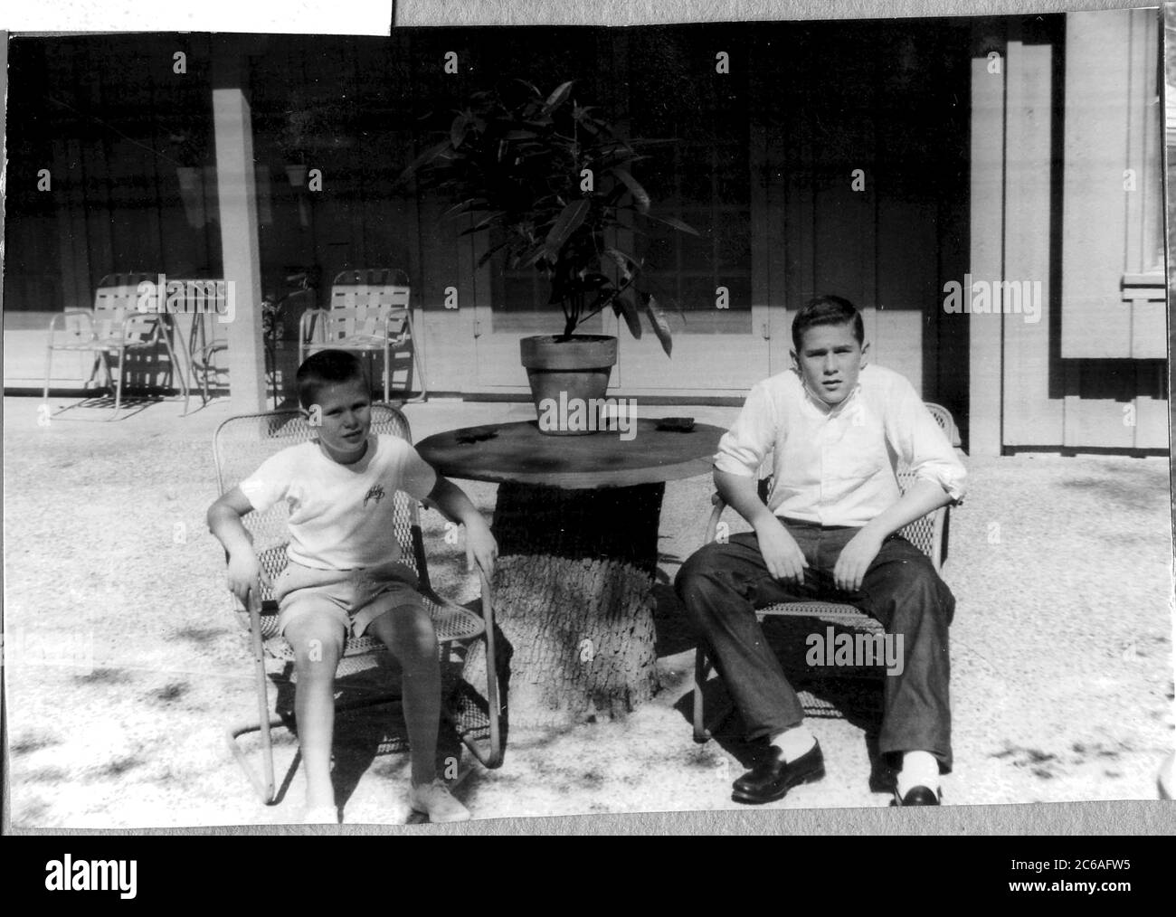 HS666 14-year-old George W., right, and younger brother Jeb rest in the ...