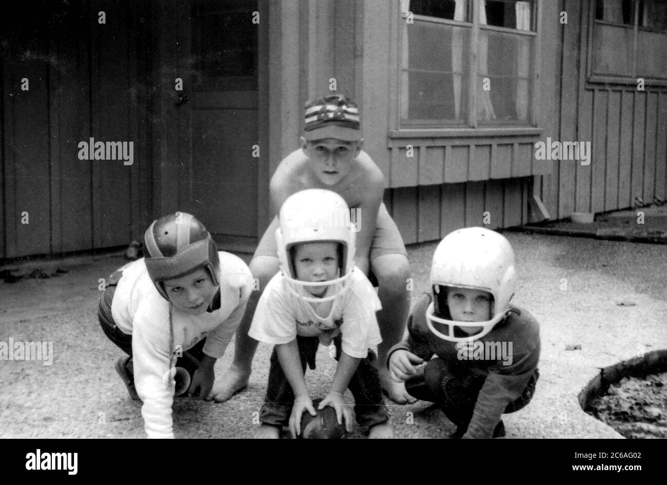 HS636 13-year-old George W. (playing quarterback), Jeb, and Neil Bush ...