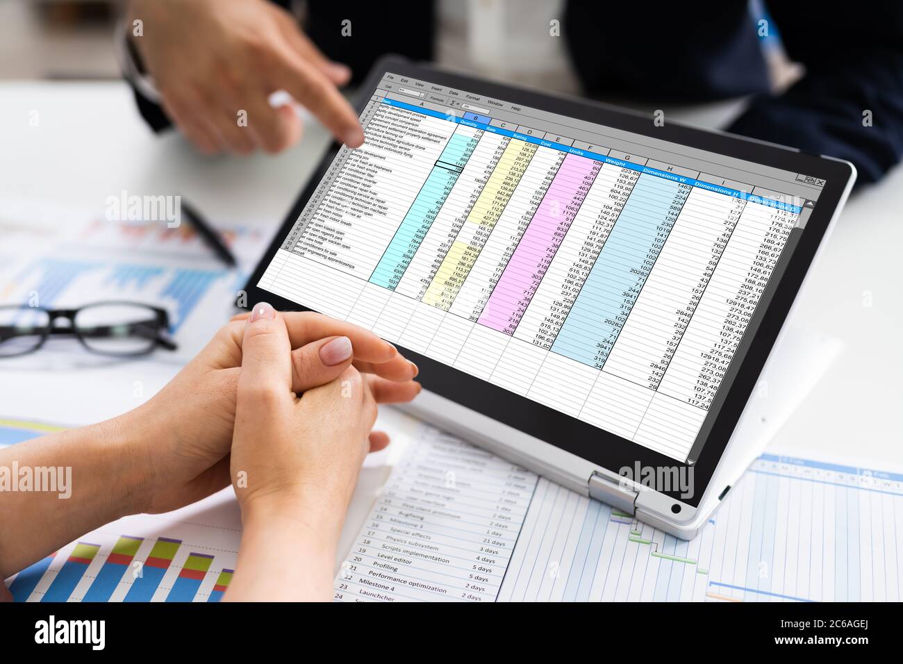 Analyst Employee Working On Spreadsheet Using Laptop Stock Photo - Alamy