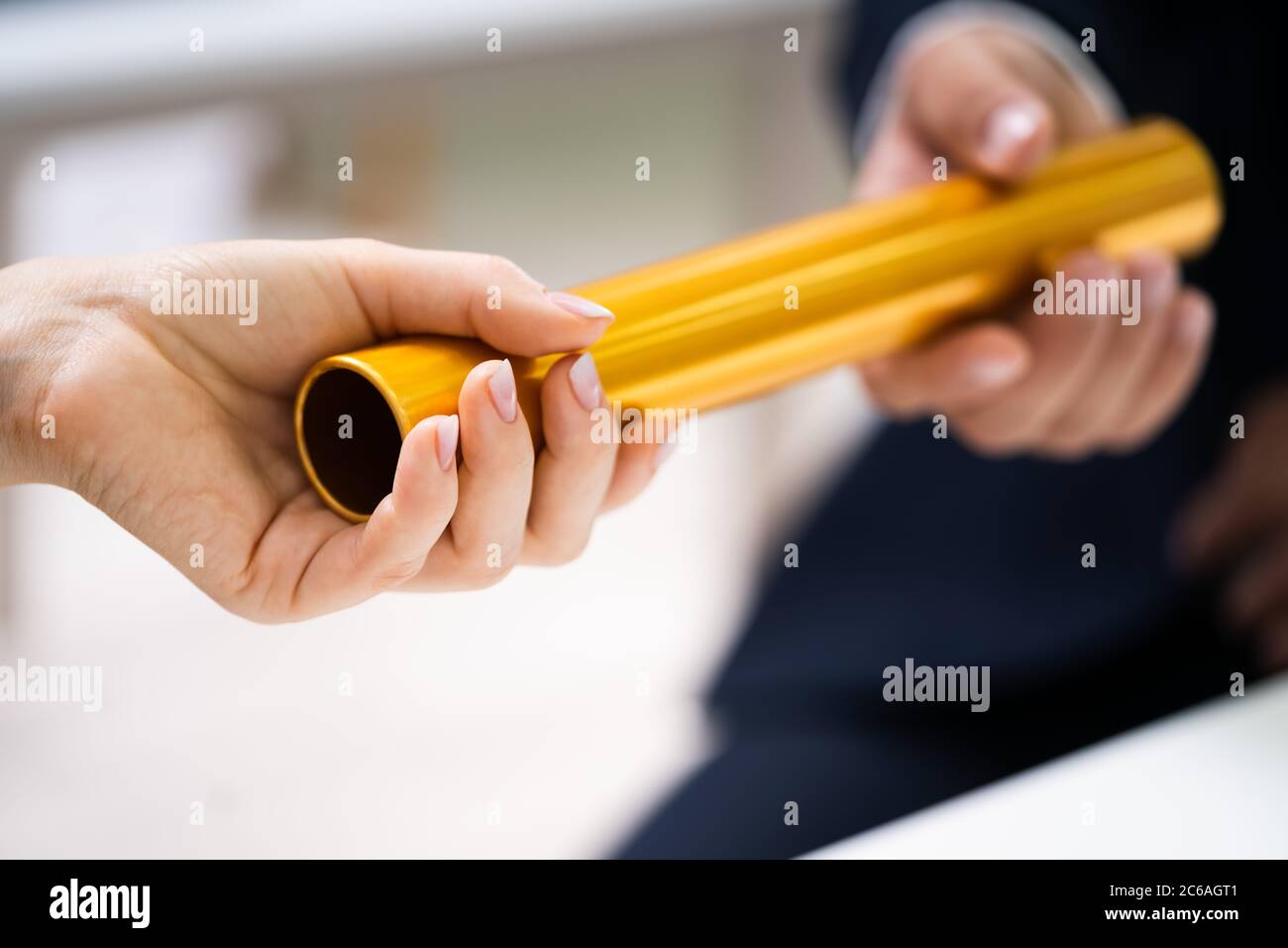 Business Man And Woman Relay Baton Handover And Pass Stock Photo - Alamy
