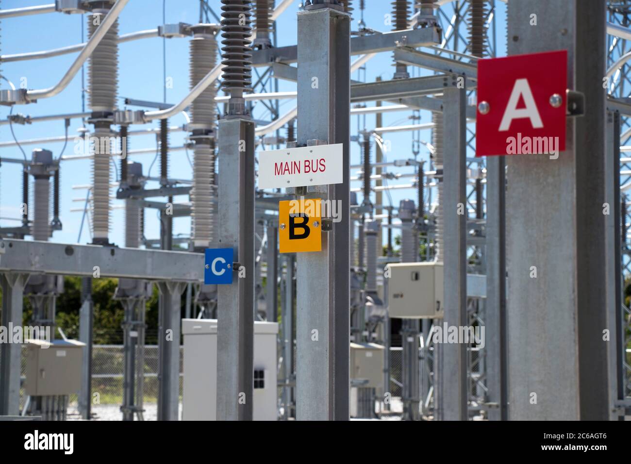 Sign showing main bus of a three-phase electrical system in the power ...