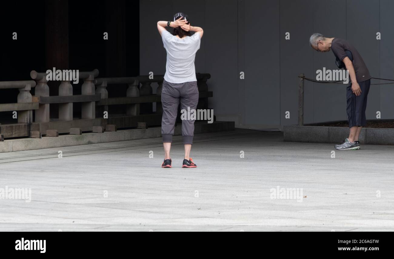 Local Japanese praying at the Meiji Jingu Shinto shrine, Tokyo, Japan ...