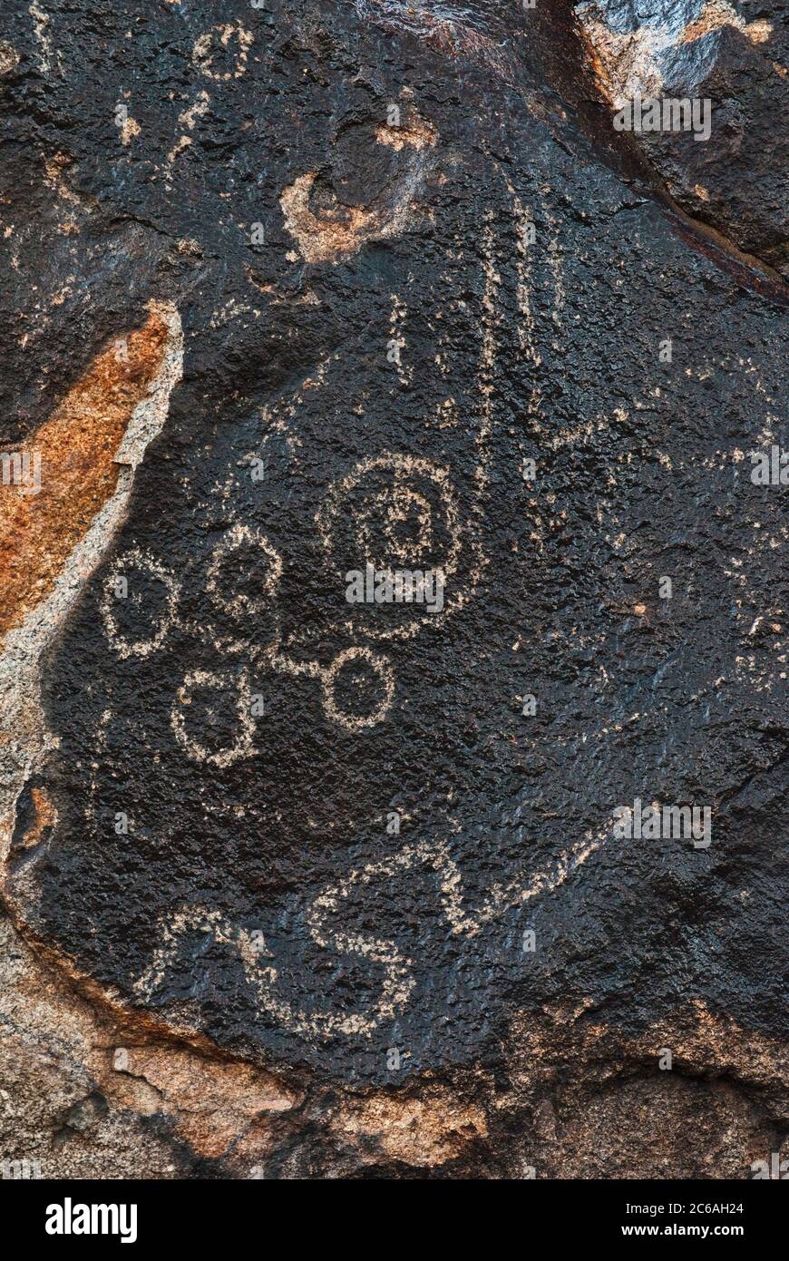 Wet petroglyphs on rainy day in Picacho Mountains, Sonoran Desert ...