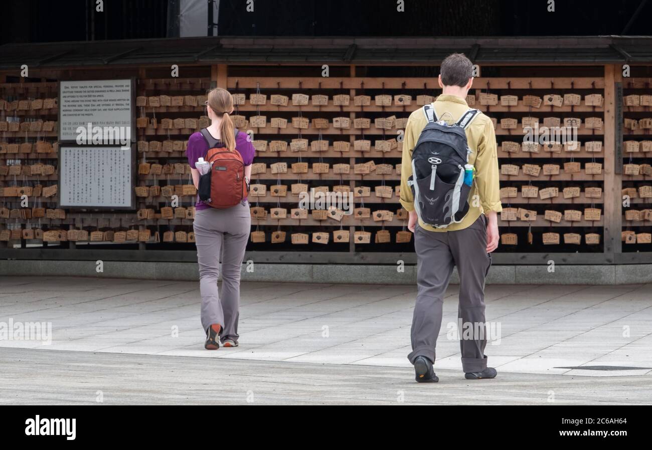 Tourists at Meiji Jingu Shinto Shrine internal compound, Tokyo, Japan ...