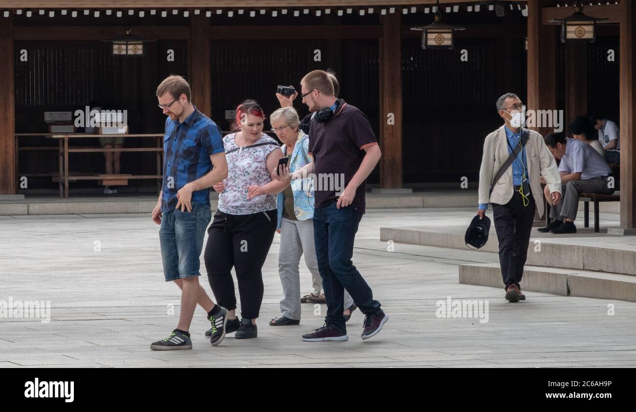 Tourists at Meiji Jingu Shinto Shrine internal compound, Tokyo, Japan ...