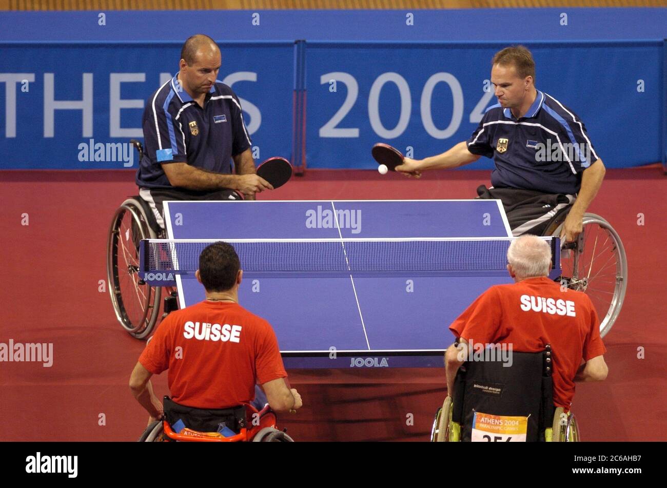 Athens, Greece 23SEP04: Switzerland's Rolf Zumkehr (red shirt with ...