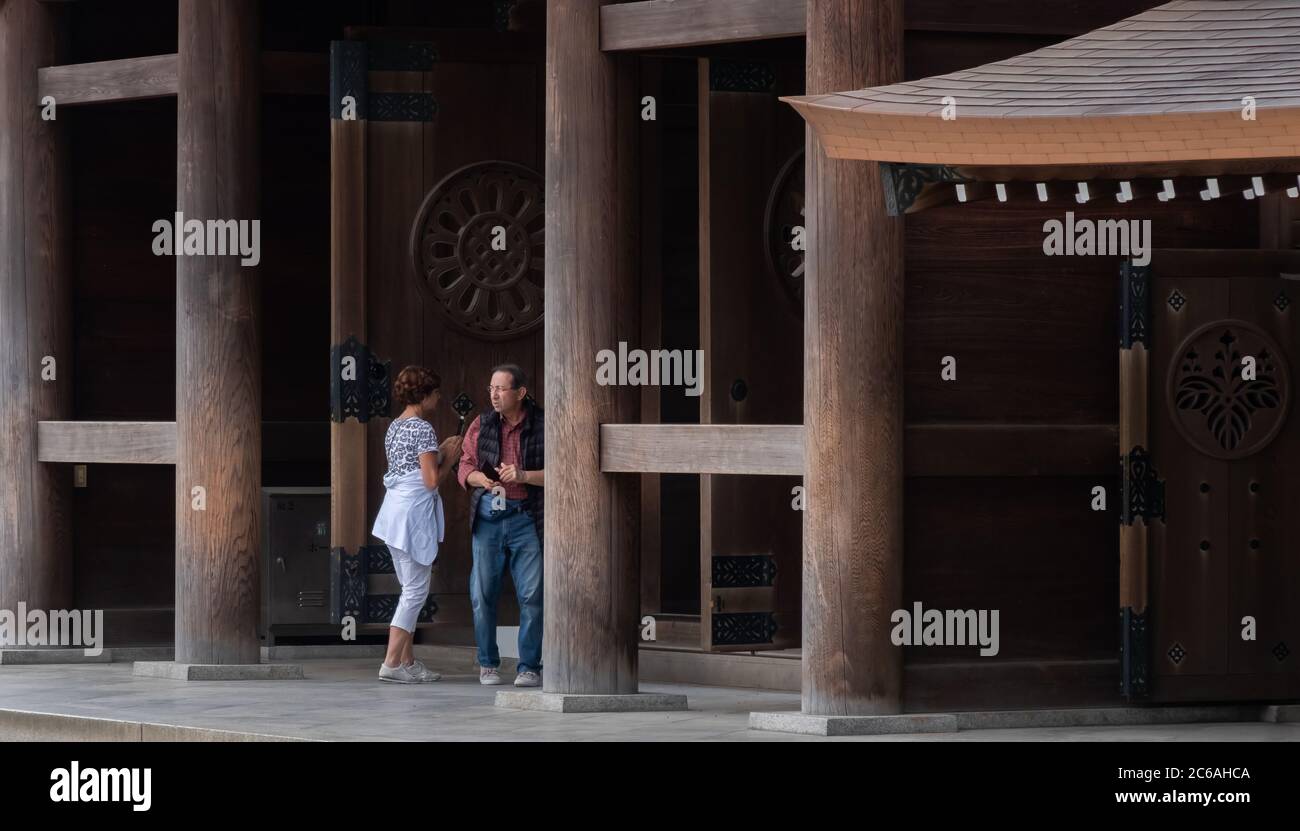 Tourists at Meiji Jingu Shinto Shrine internal compound, Tokyo, Japan ...