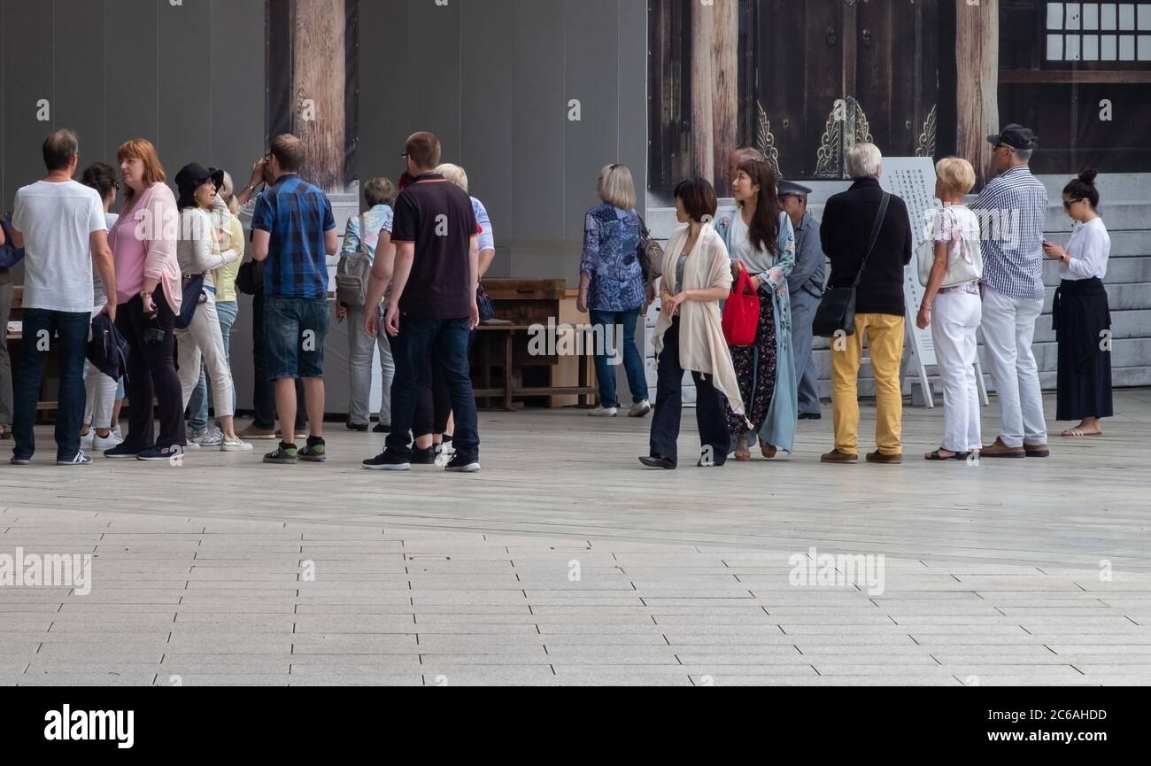 Tourists at Meiji Jingu Shinto Shrine internal compound, Tokyo, Japan ...