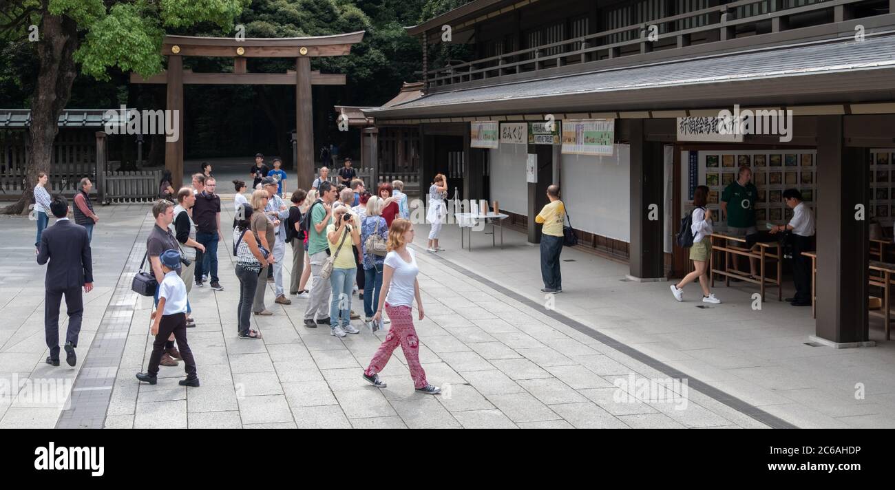 Tourists at Meiji Jingu Shinto Shrine internal compound, Tokyo, Japan ...