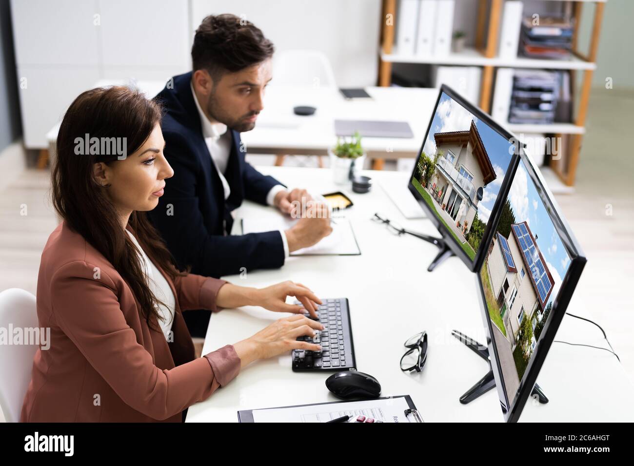 Two Engineers Using Computer Monitor At Office Stock Photo - Alamy