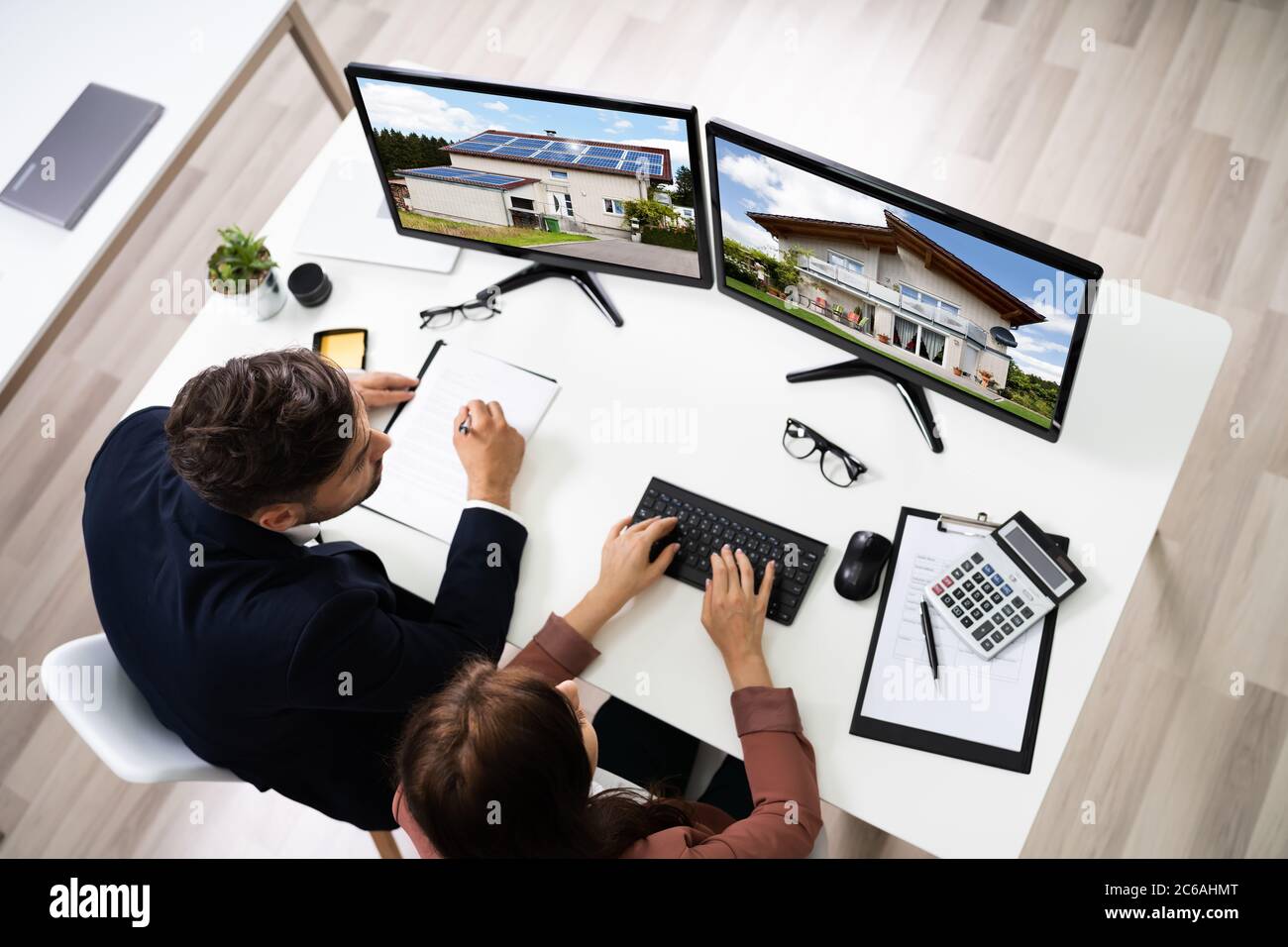 Two Engineers Using Computer Monitor At Office Stock Photo - Alamy
