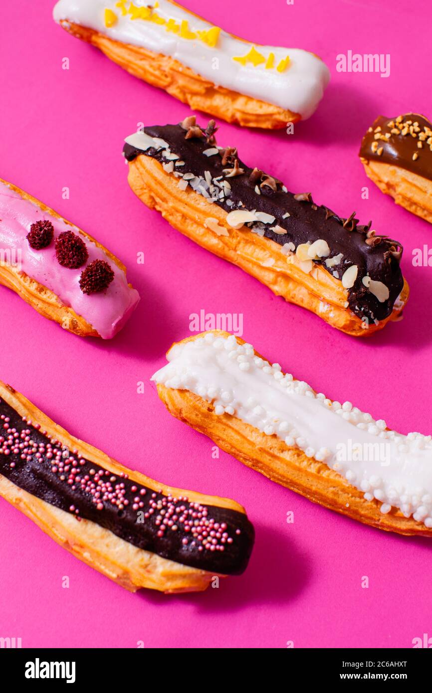 Several eclairs with different colored types of fillings Stock Photo ...