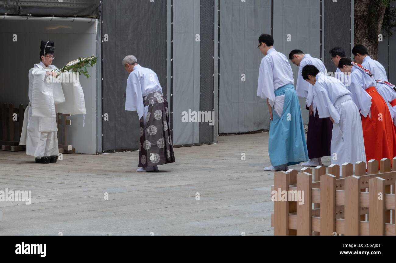 Temple priests in traditional clothing at Meiji Jingu Shinto shrine ...