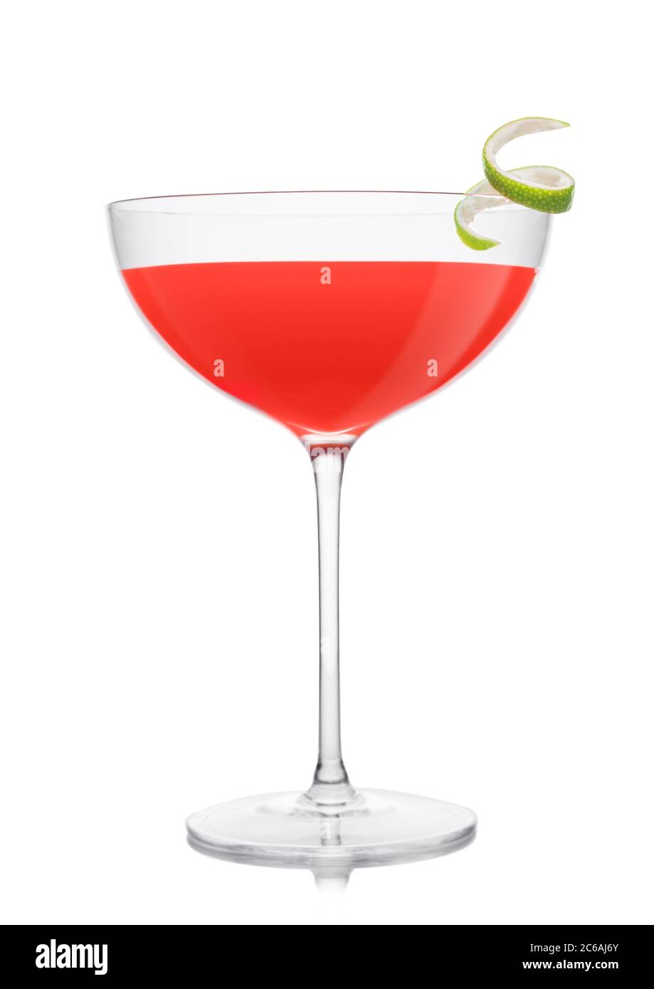 Cosmopolitan cocktail in luxury crystal glass with lime peel on white ...