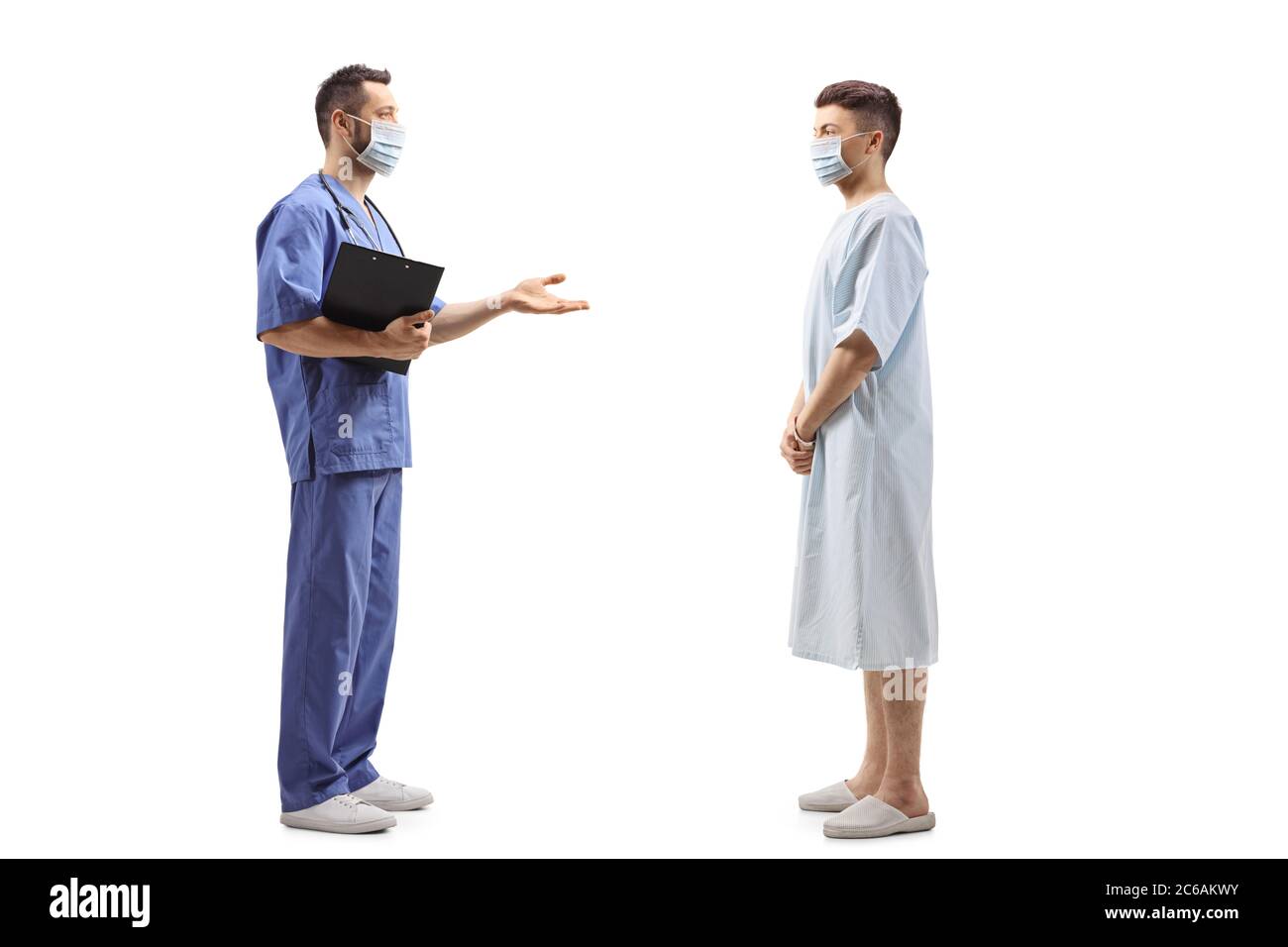 Full length profile shot of a medical worker with a face mask talking ...