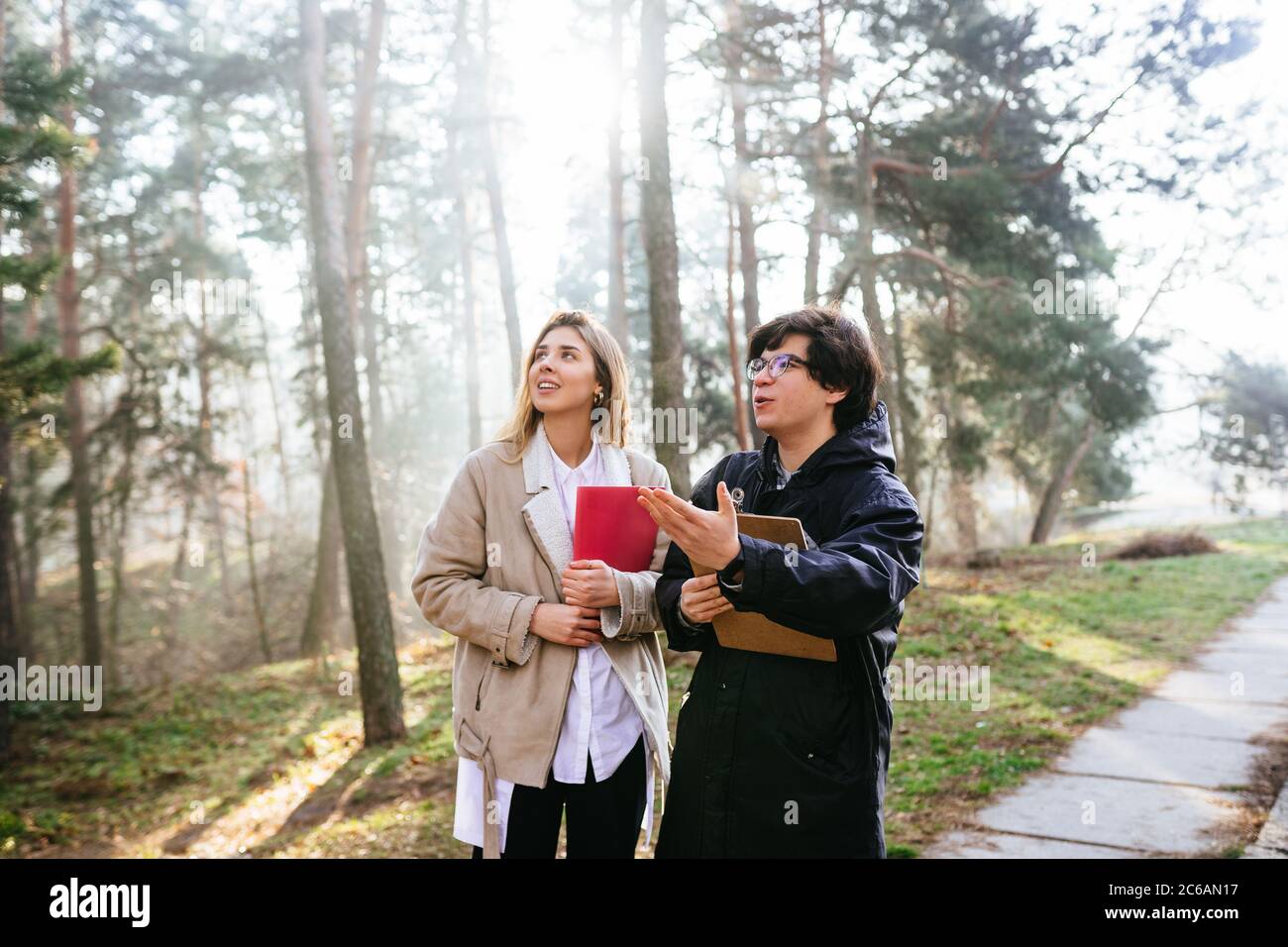 Scientists are studying plant species and inspect trees in the forest ...