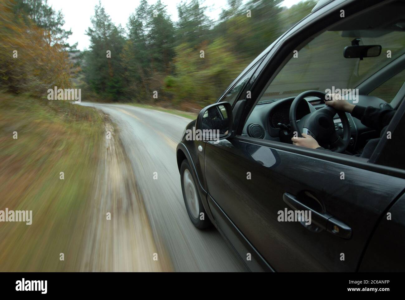 Car driving on country road Stock Photo - Alamy