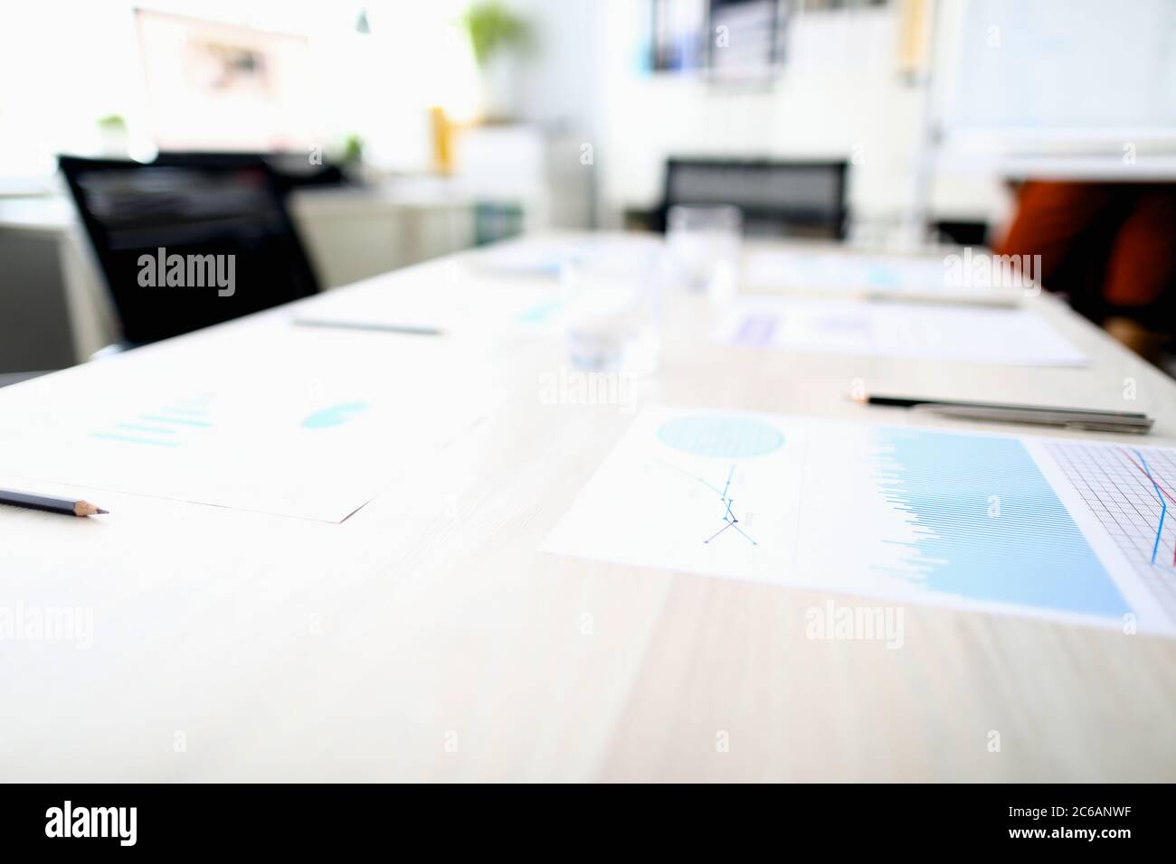 Desk in office with meeting documents Stock Photo - Alamy