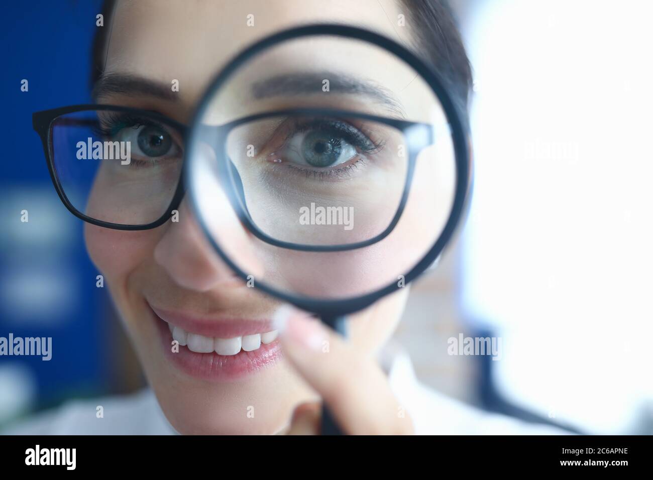 Woman with magnifying lenses hi-res stock photography and images - Alamy
