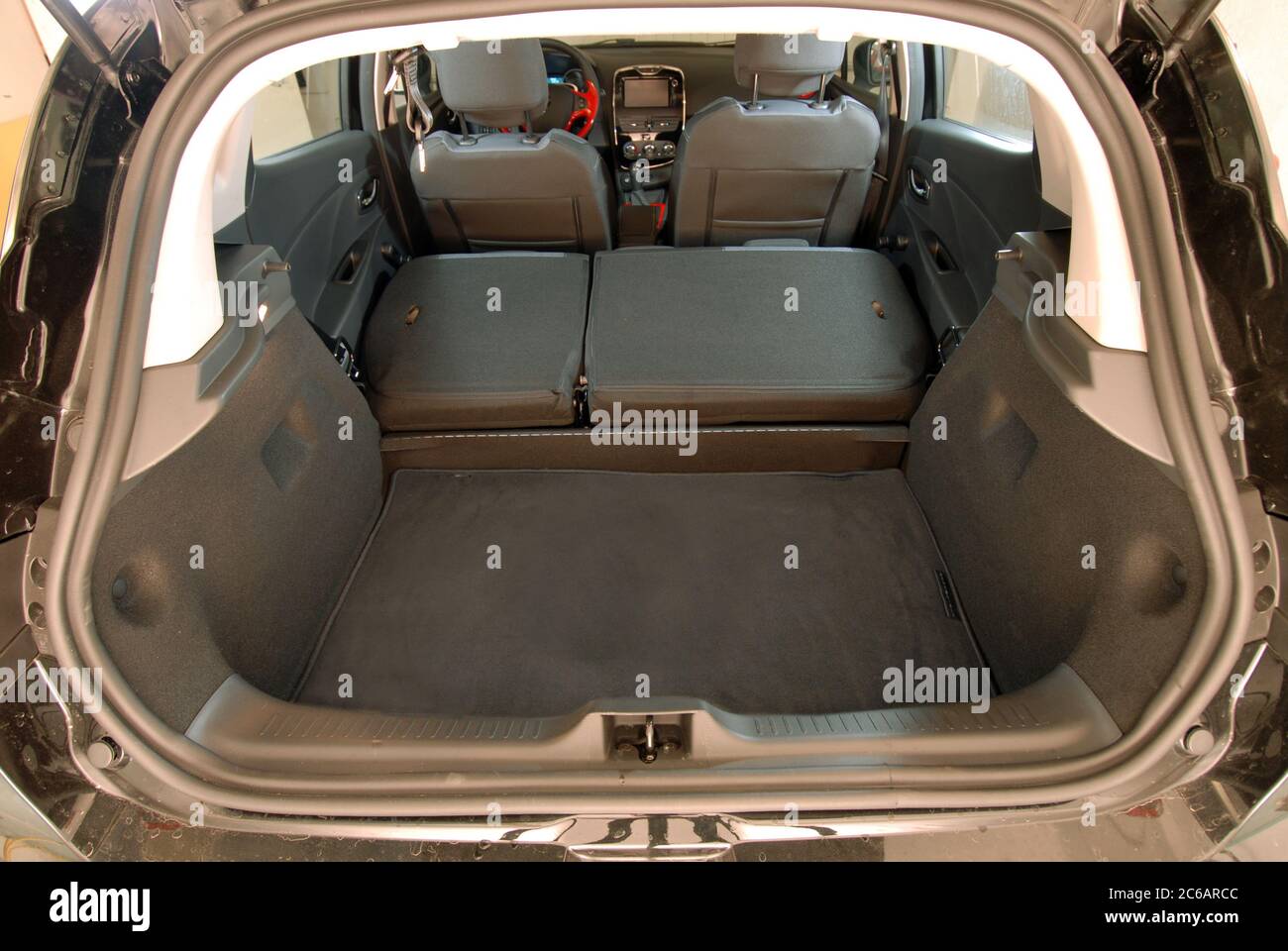 car trunk with rear seats folded Stock Photo - Alamy