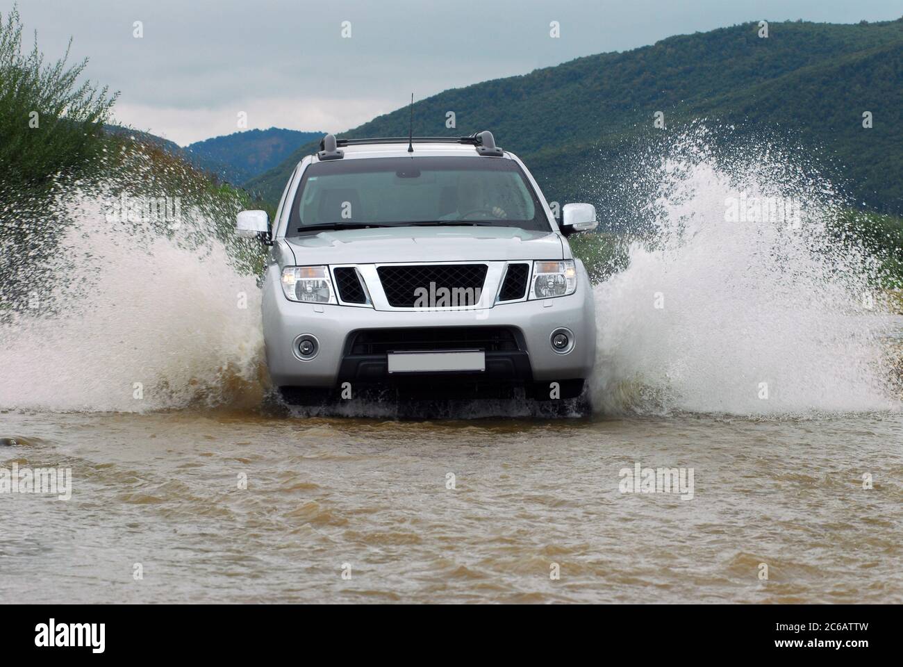 SUV crosses the river Stock Photo - Alamy