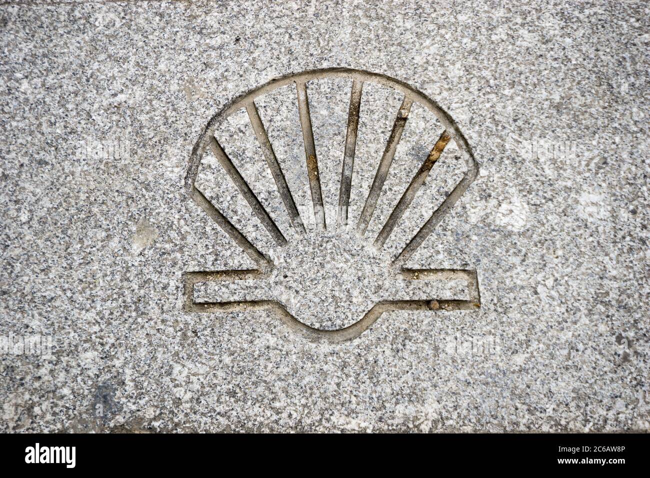 Pilgrim sign of shell mark on a street in Guimaraes, Camino de Santiago ...