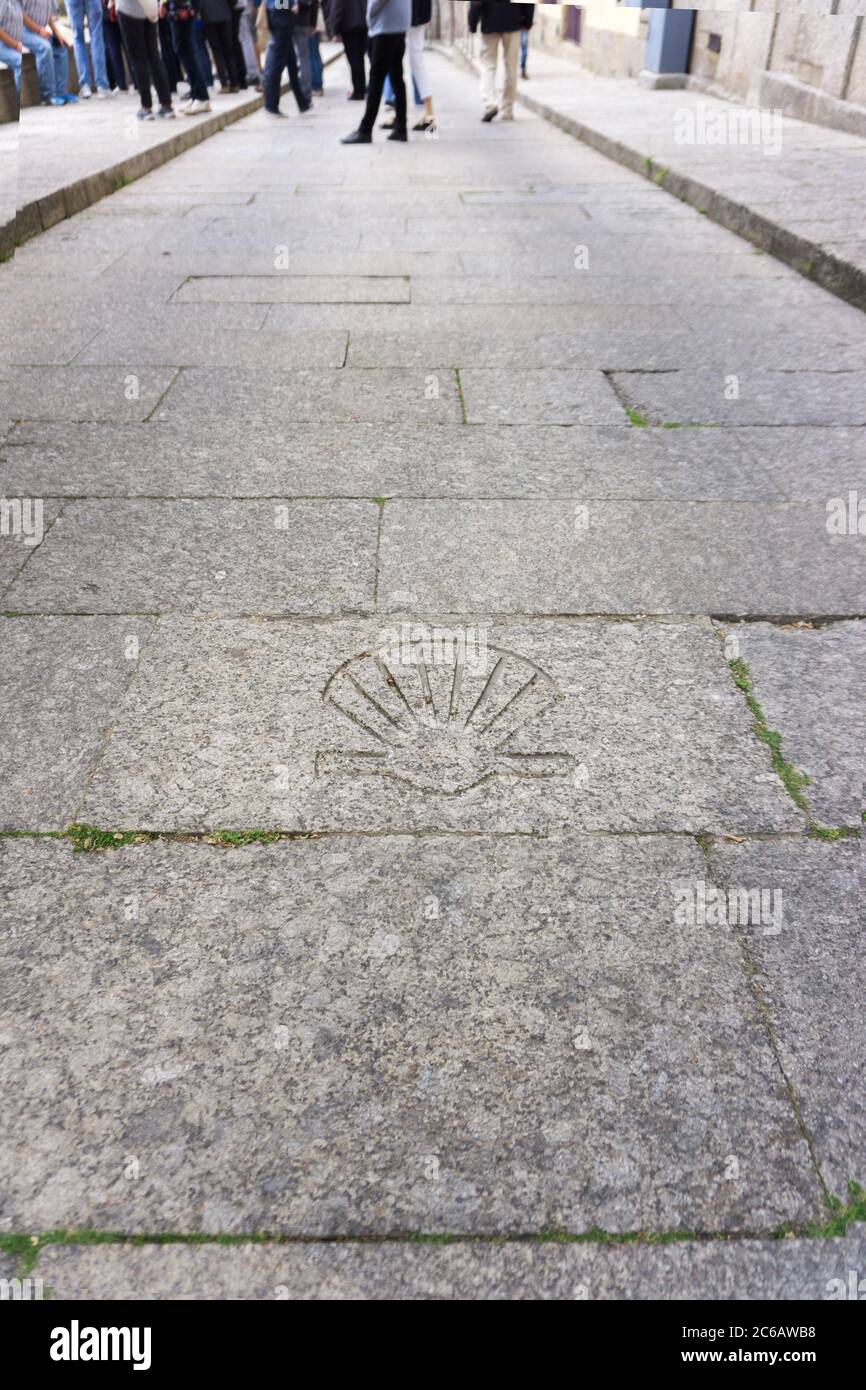 Pilgrim sign of shell mark on a street in Guimaraes, Camino de Santiago ...