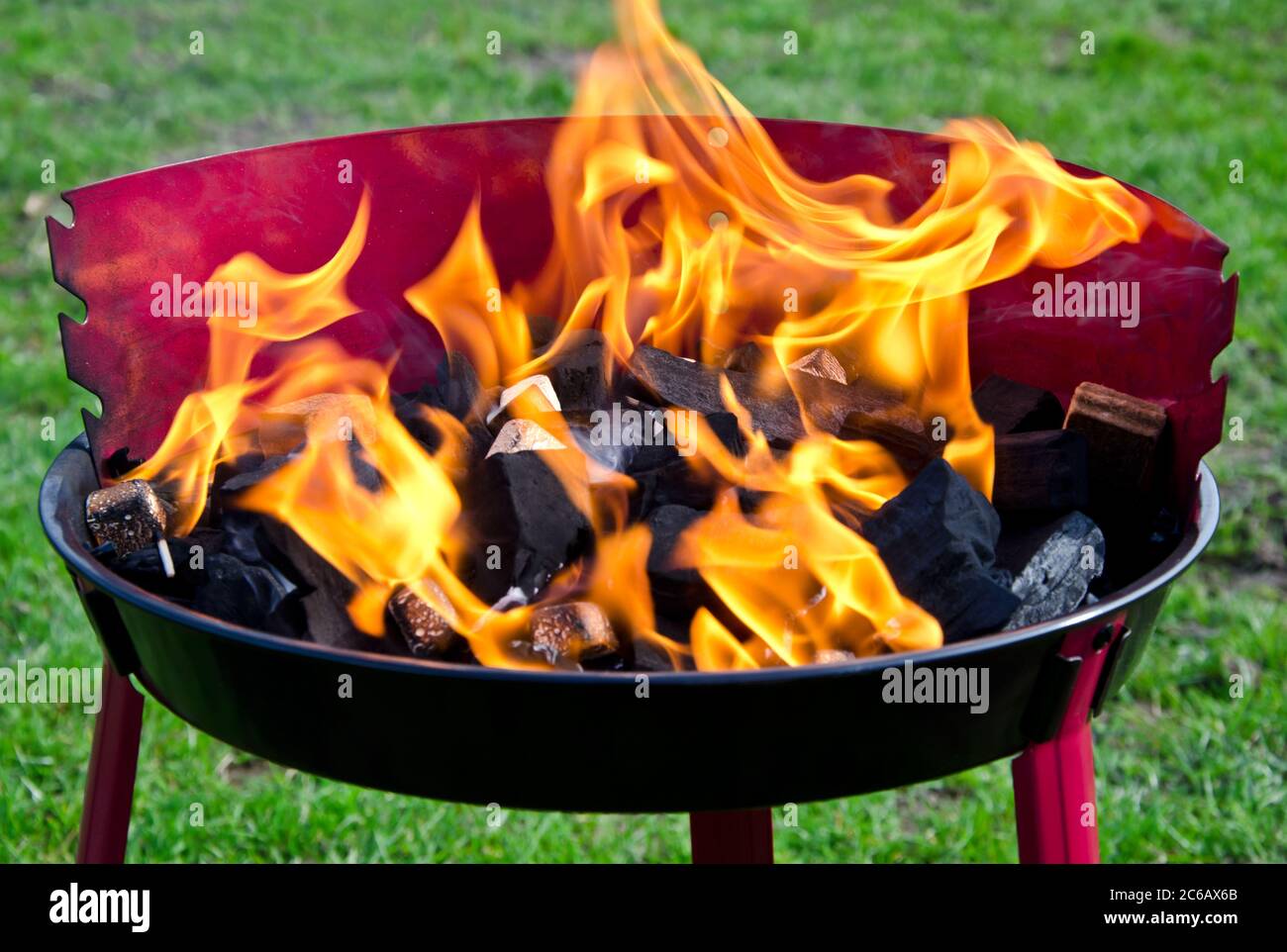 Flames and coal on a barbecue grill Stock Photo - Alamy