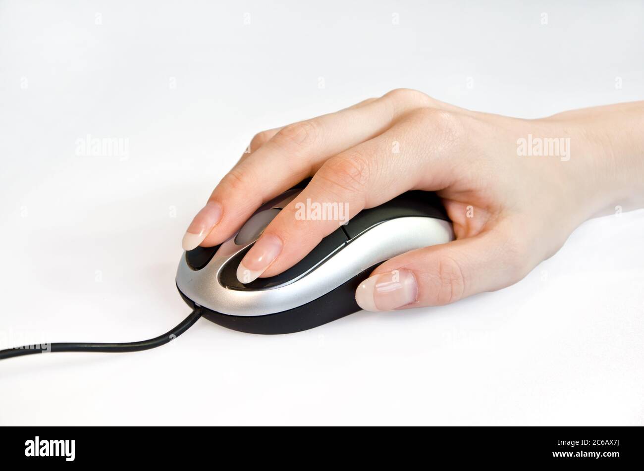 Female hand using computer mouse in front of white background Stock ...