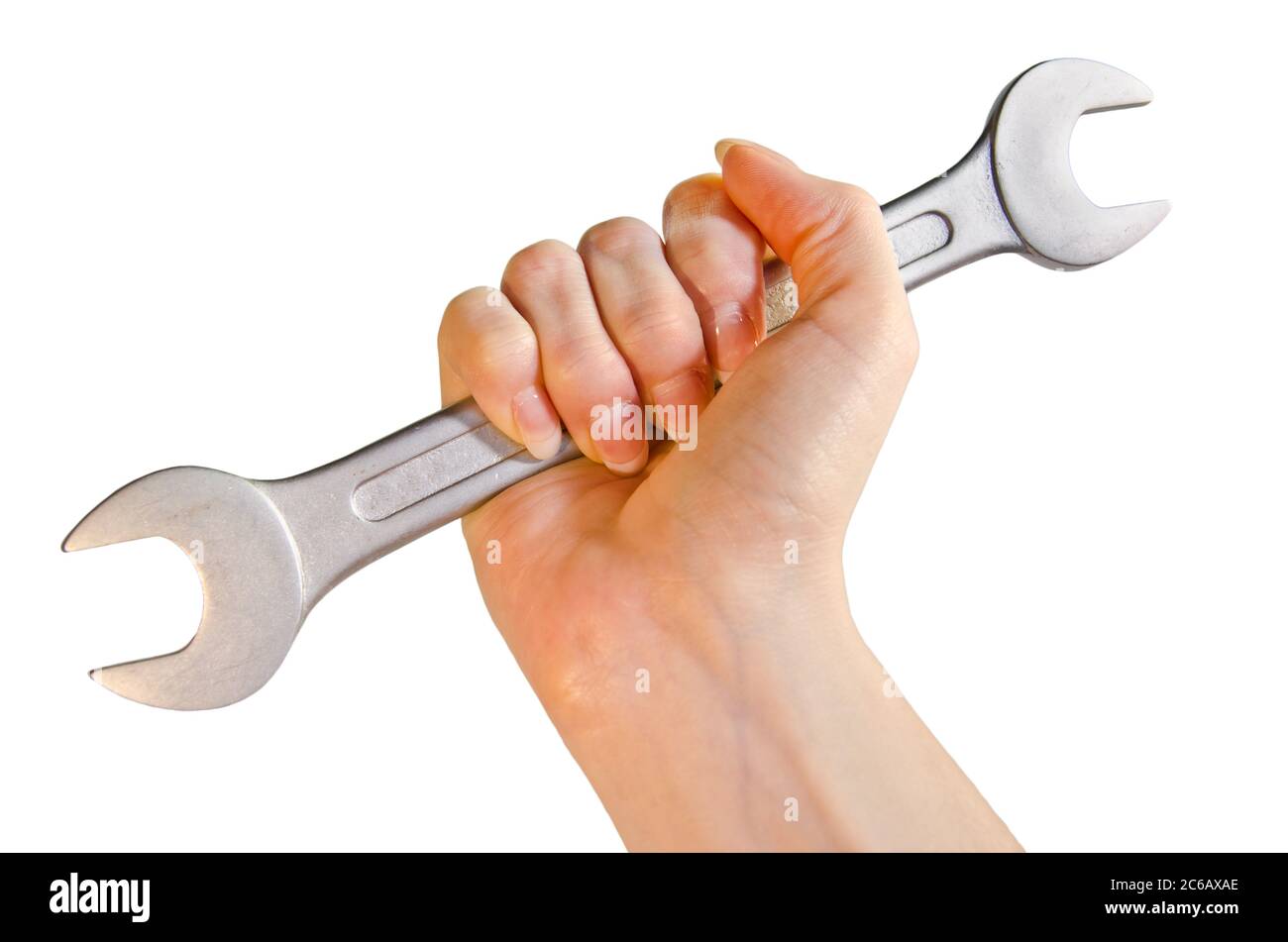 Female hand holding wrench in front of white background Stock Photo - Alamy