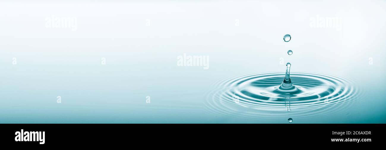 water drip falling on water mirror. Water drop splash and make perfect ...