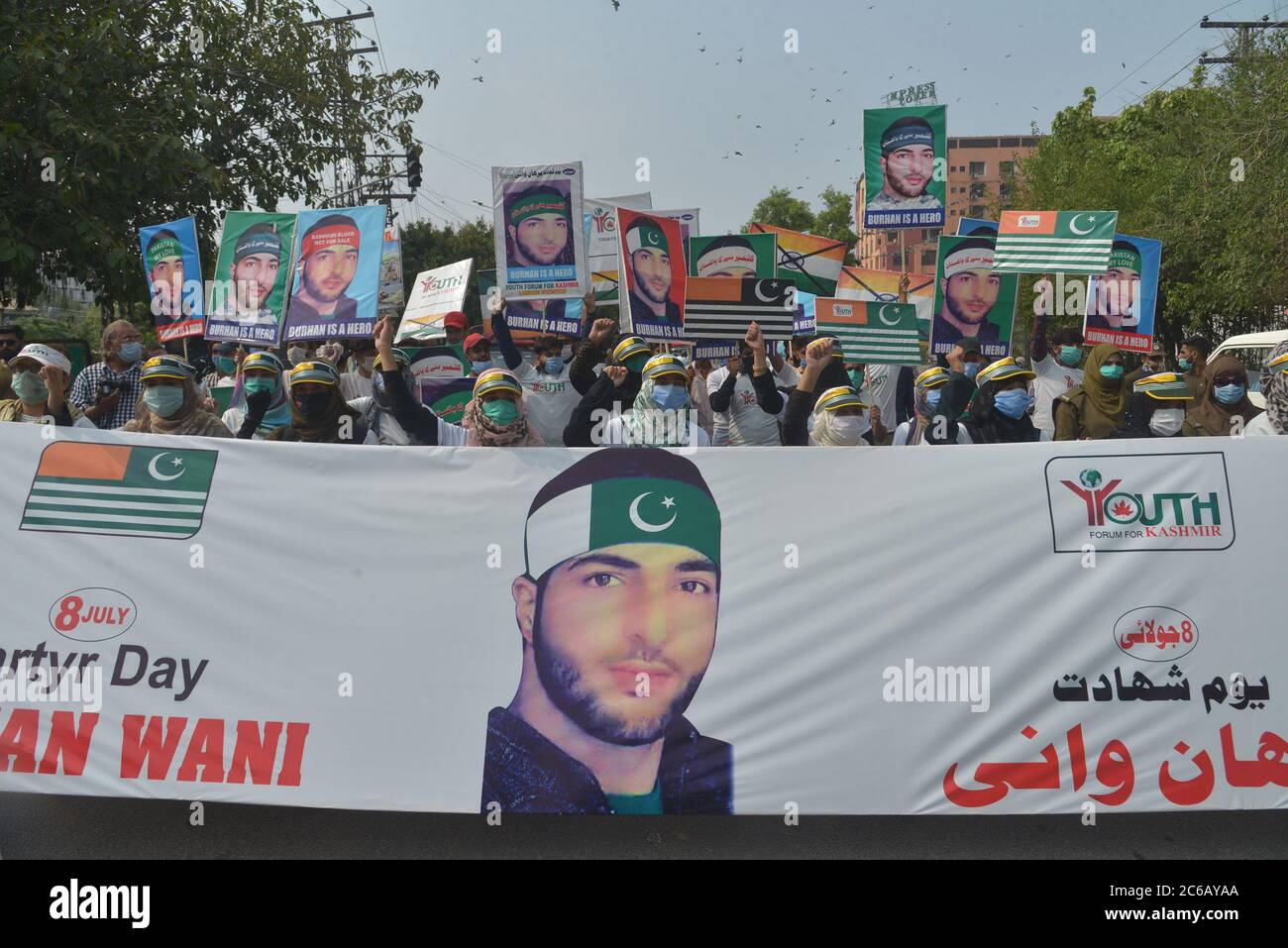 Pakistani activists of Youth Forum for Kashmir hold placards featuring ...