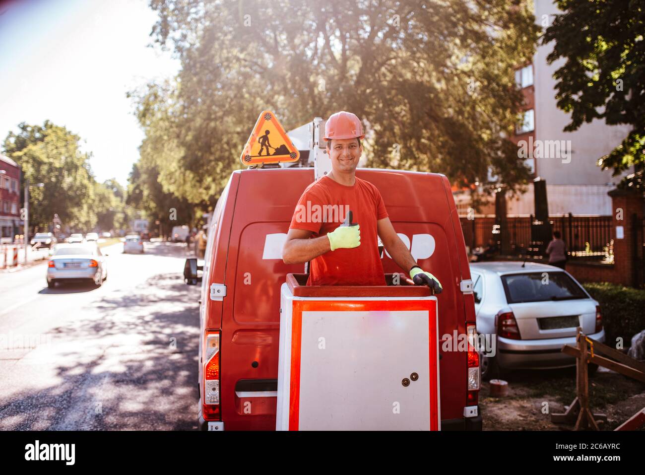 Man climbing a traffic light hi-res stock photography and images - Alamy
