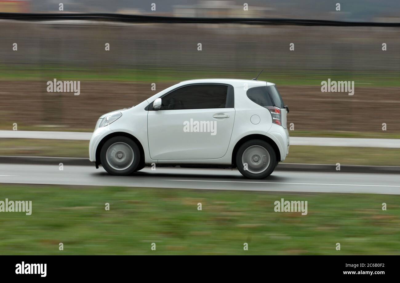 Car moving on road small hi-res stock photography and images - Alamy