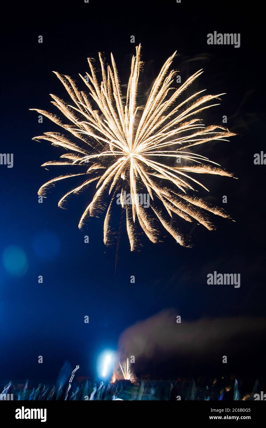 Beautiful colorful fireworks in the sky on a festive night. Vertical ...