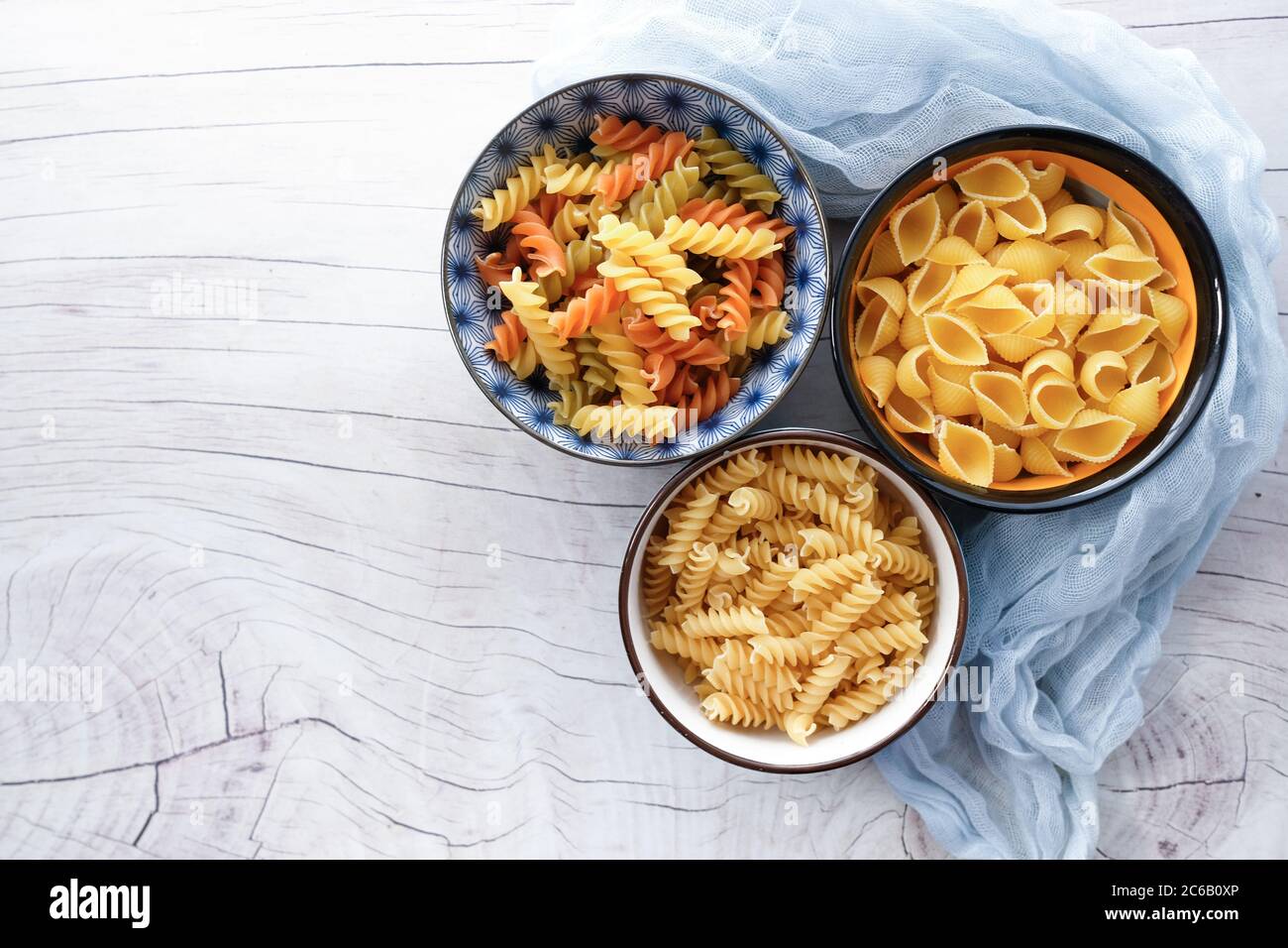 Variety of types and shapes of dry Italian pasta in a bowl Stock Photo ...