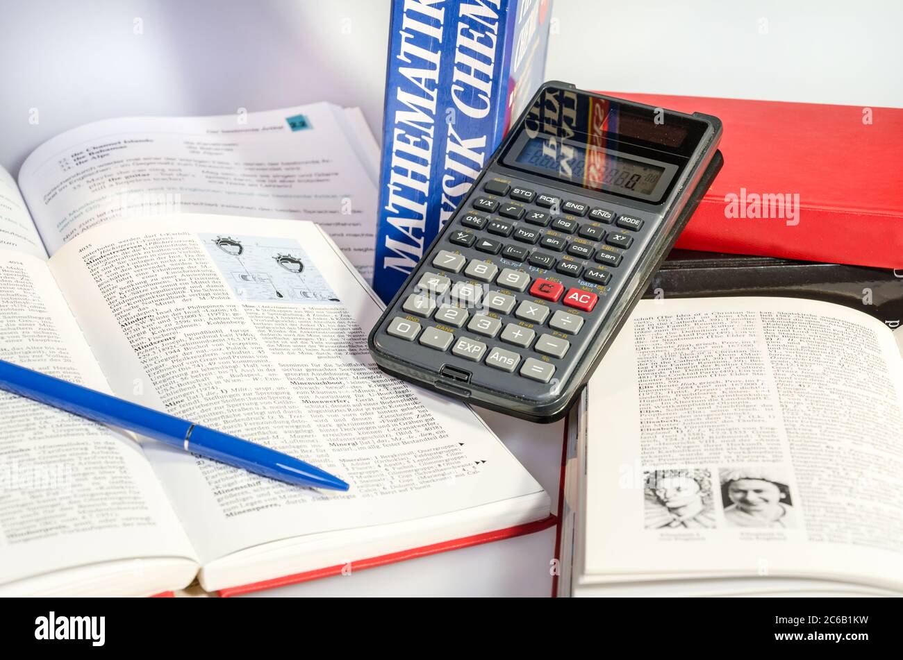 Books, pen and calculator Stock Photo - Alamy