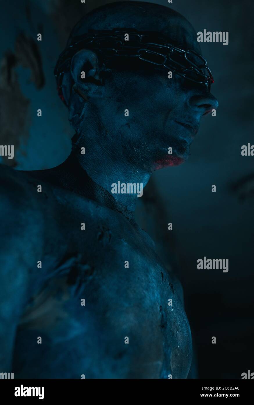 Cosplayer portrays of a paranormal monster with eyes bound with chains ...