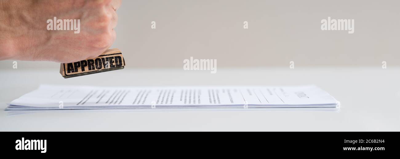 Work Permit And Document Record Approved Stamper Stock Photo - Alamy