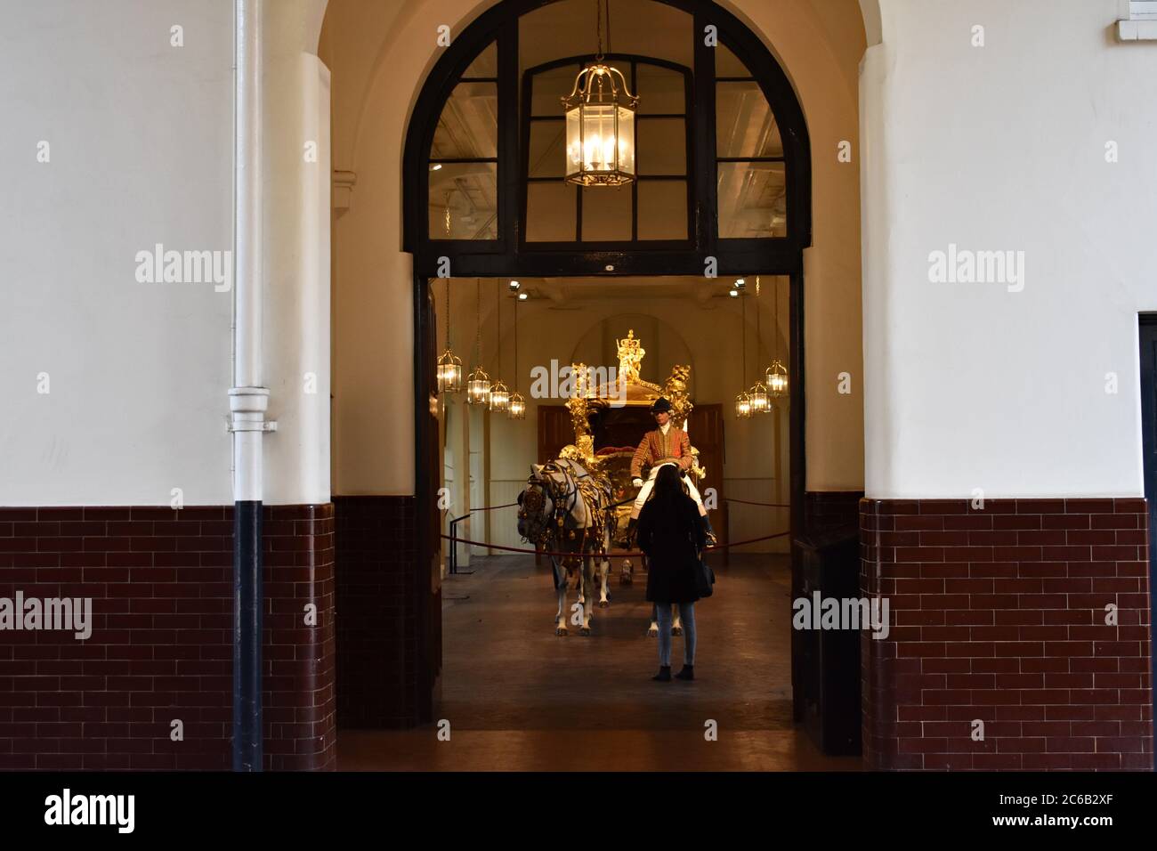 The Gold State Coach seen through a doorway in the Royal Mews at ...