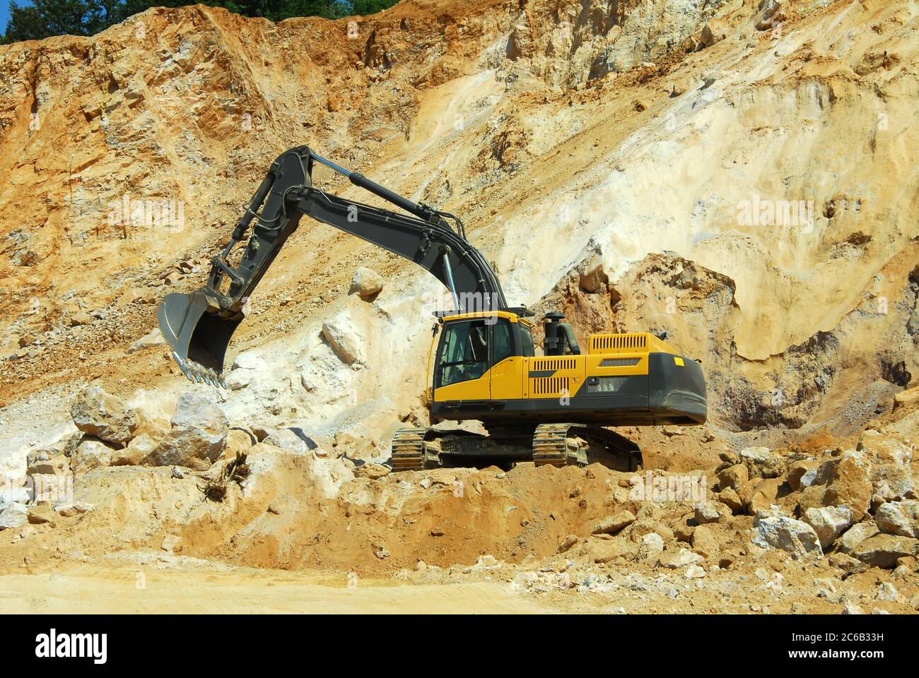 big yellow loader stands in the quarry Stock Photo - Alamy
