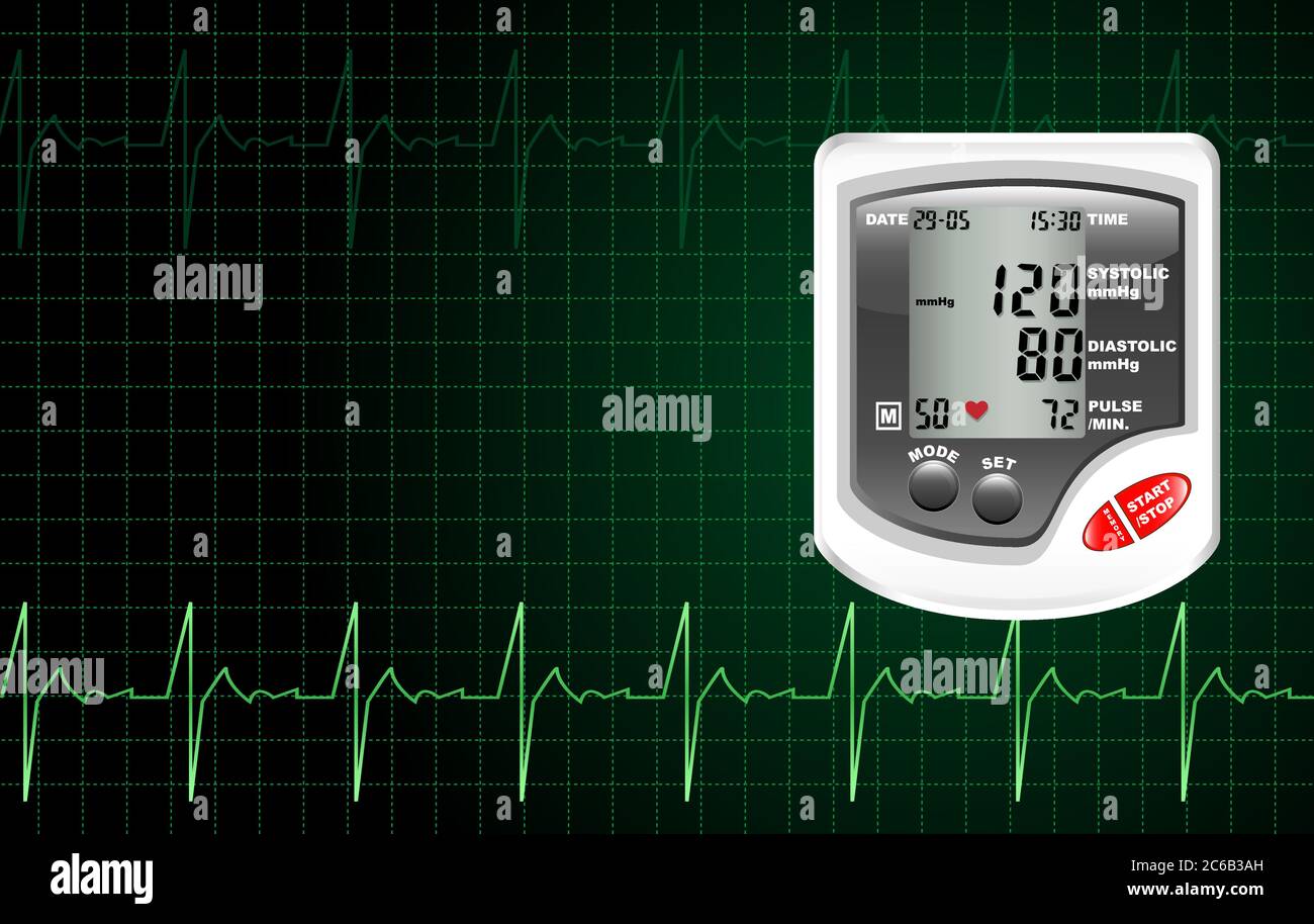 A digital blood pressure monitor against a computer screen showing ...