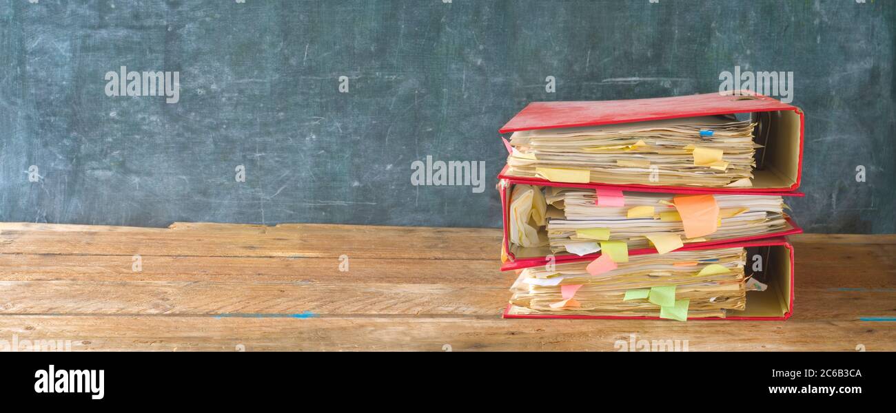 messy file folders and documents, bureaucracy and red tape concept ...
