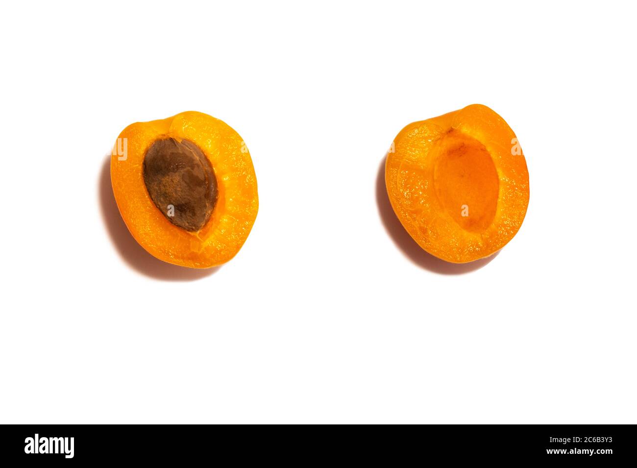 Top view of apricot halves isolated on white background Stock Photo - Alamy