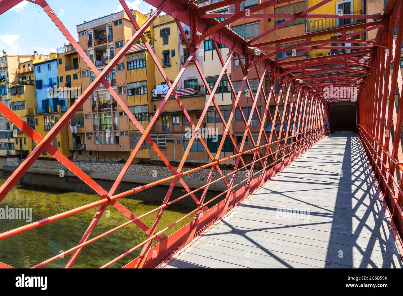 Red iron bridge - Eiffel bridge in Girona, in a beautiful summer day ...