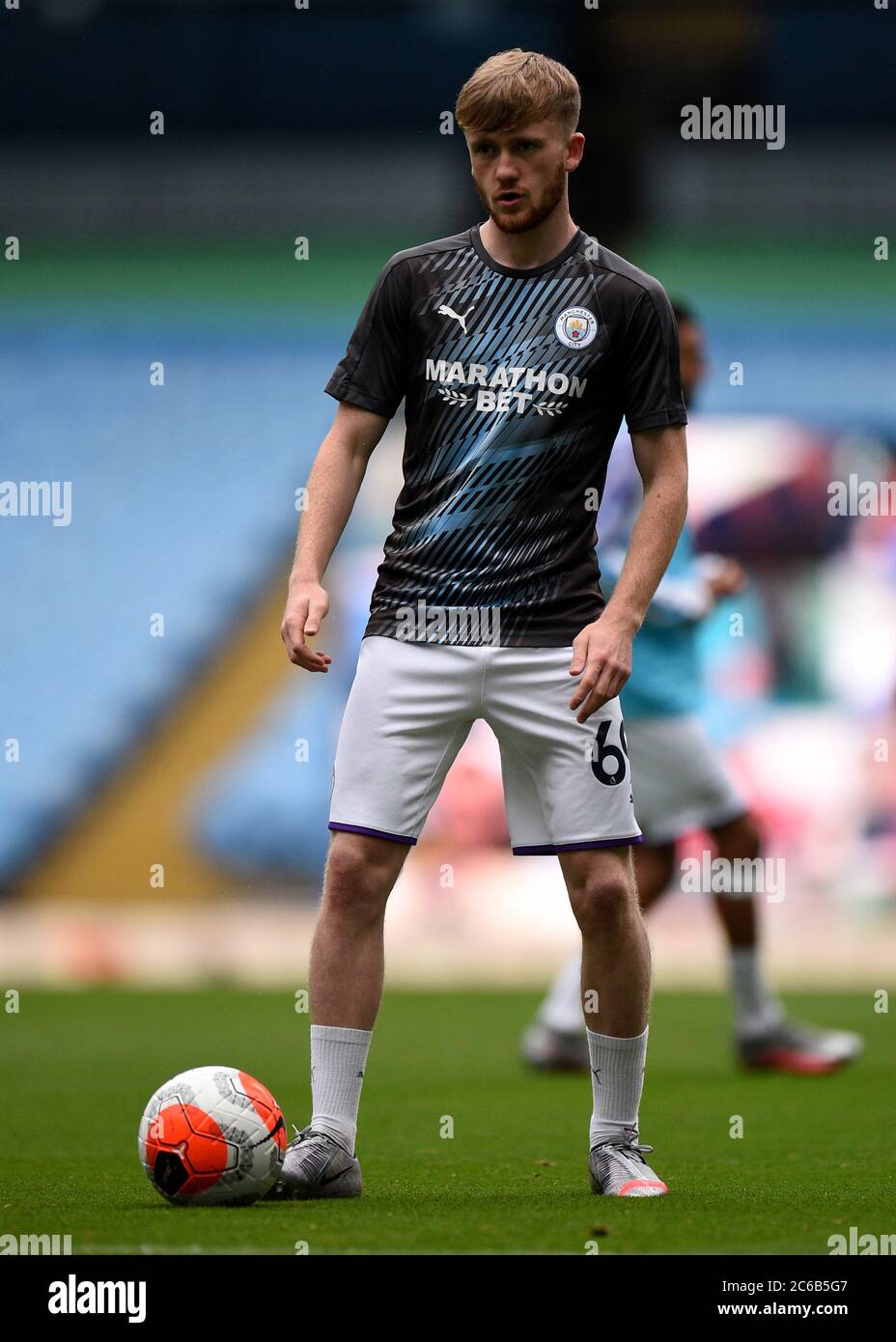 Manchester City's Tommy Doyle warms up during the Premier League match ...