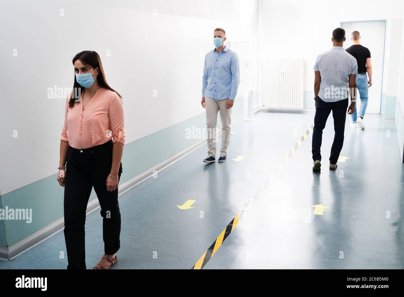 People In Office Following Social Distancing Protocols Wearing Face ...